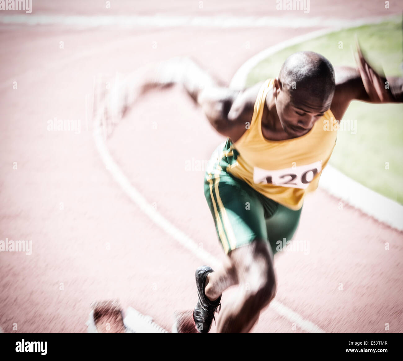 Sprinter taking off from starting block Stock Photo - Alamy