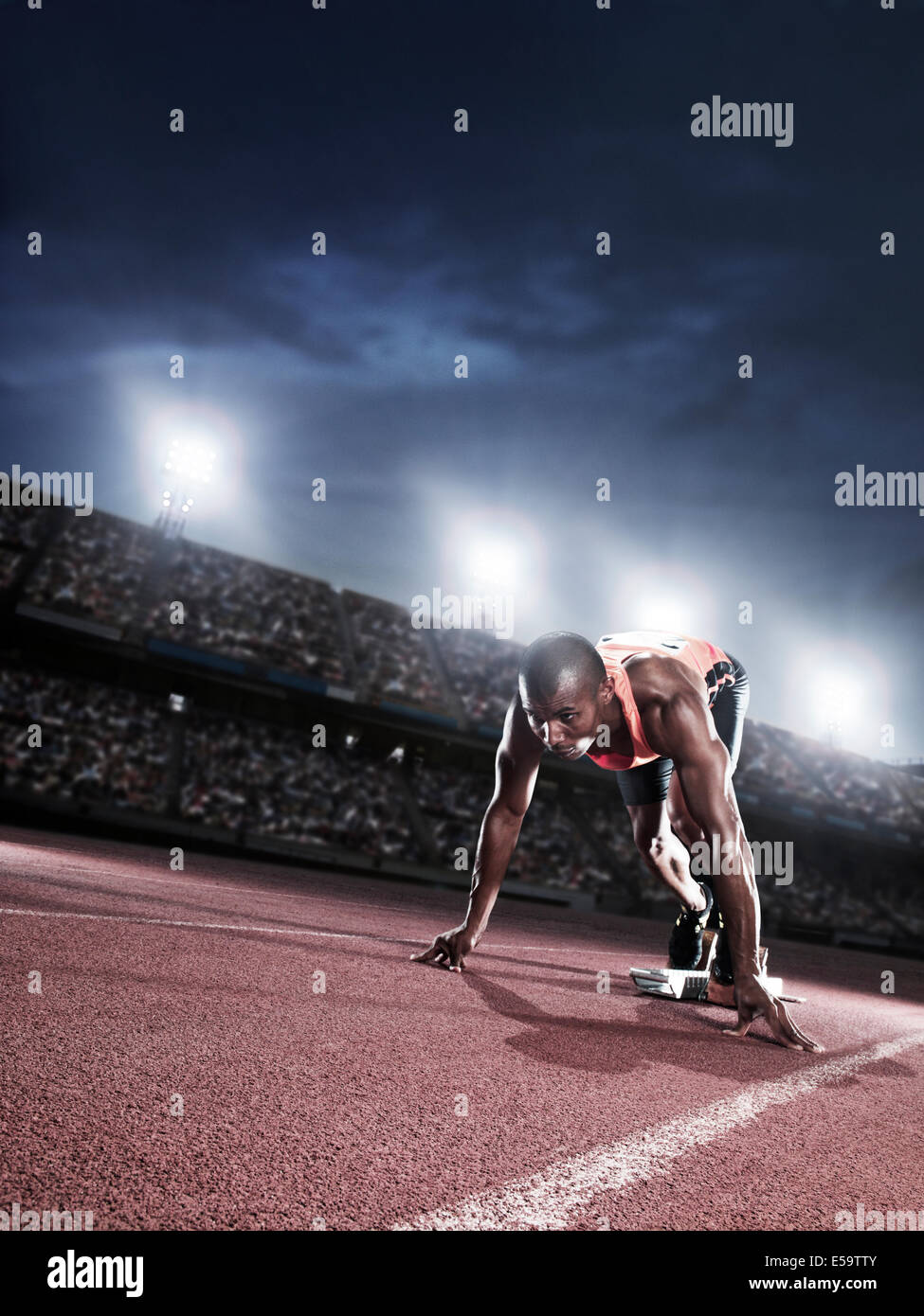 Runner poised at starting line on track Stock Photo - Alamy Runner poised at starting line on track Stock Photo - Alamy