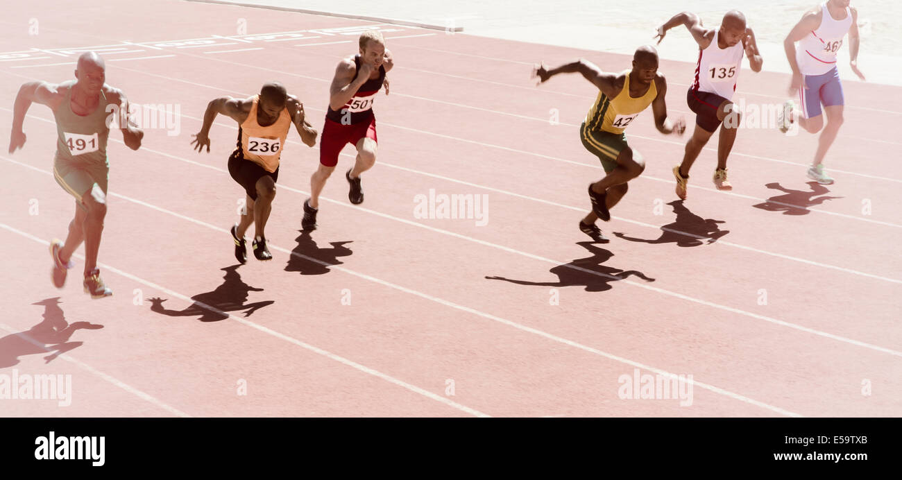 Runners racing on track Stock Photo - Alamy