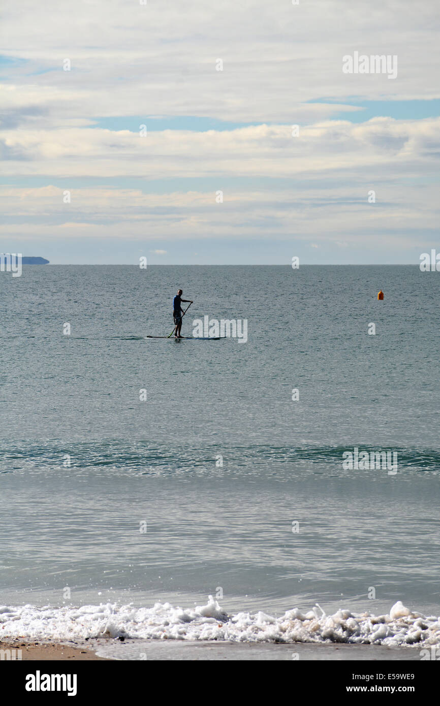 Man doing stand up paddle surf near the Takapuna Beach with the ...