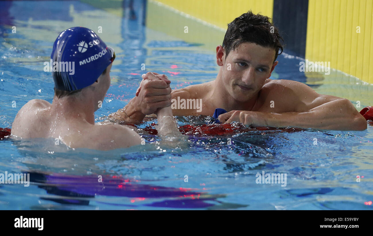 Glasgow. 24th July, 2014. Ross Murdoch of Scotland is congratulated by ...