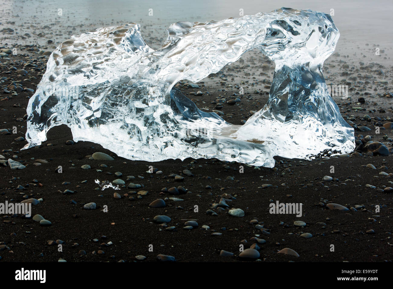 Iceberg on black sand beach at Jokulsarlon - Southeast Iceland Stock ...