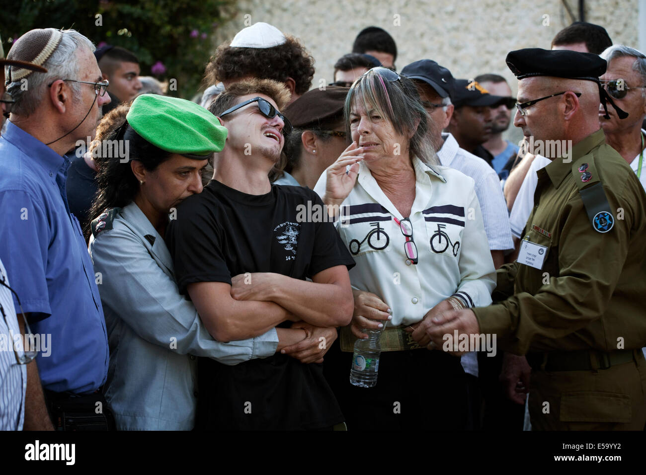 Kfar Azar, Israel, 24th July, 2014. The mother and the brother of Staff ...