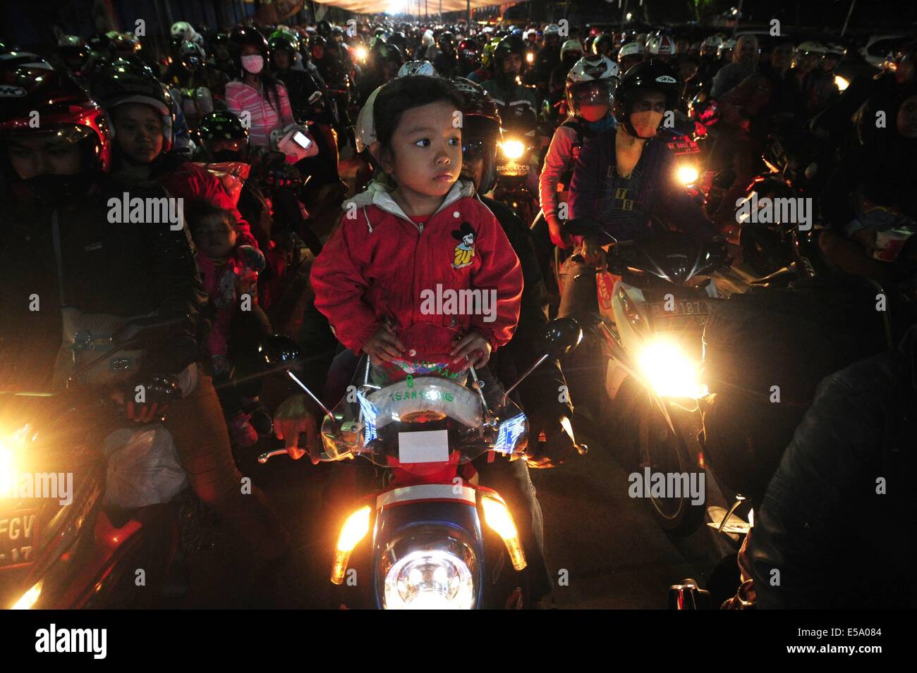 Jakarta, Indonesia. 25th July, 2014. Riders on their motorbikes queue ...
