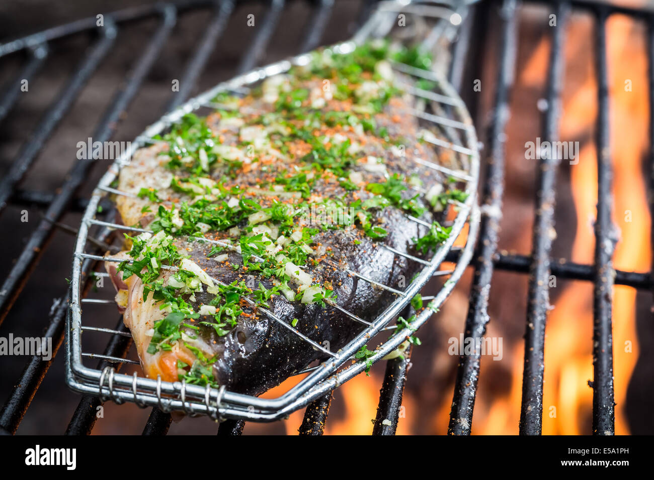 Fire roasted fish hi-res stock photography and images - Alamy
