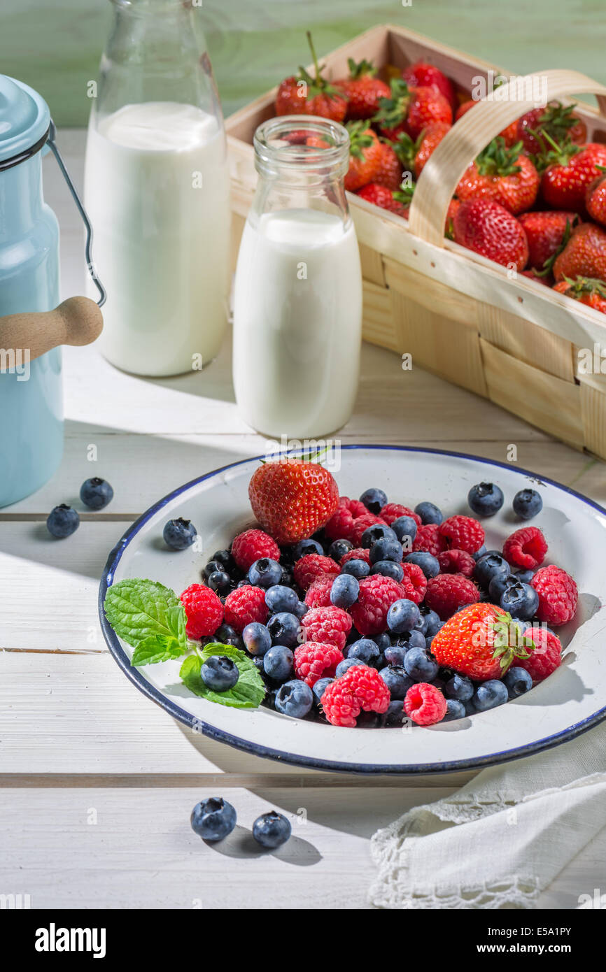 Fresh berry fruits with milk Stock Photo - Alamy