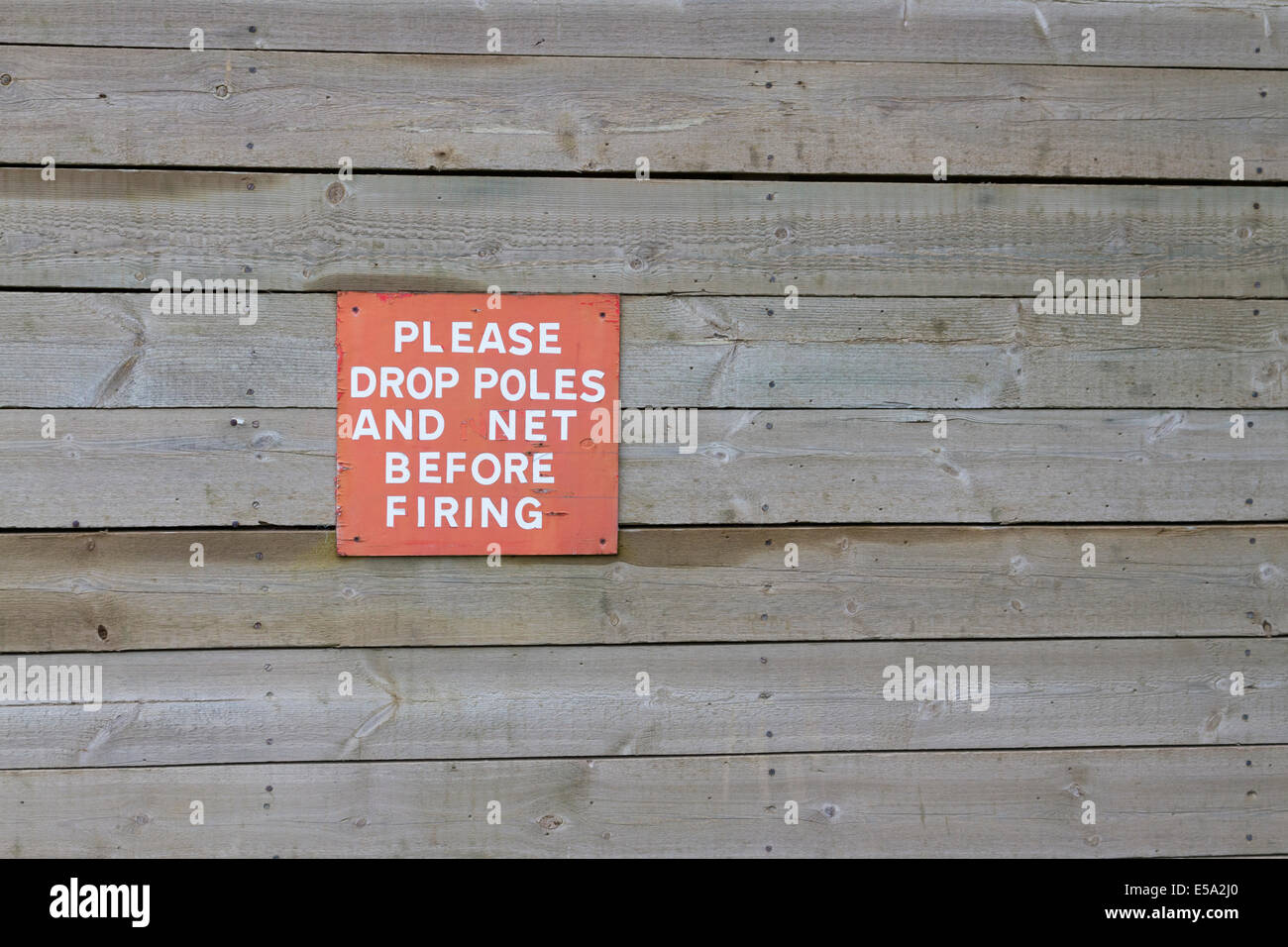 Please drop poles and net before firing Stock Photo - Alamy