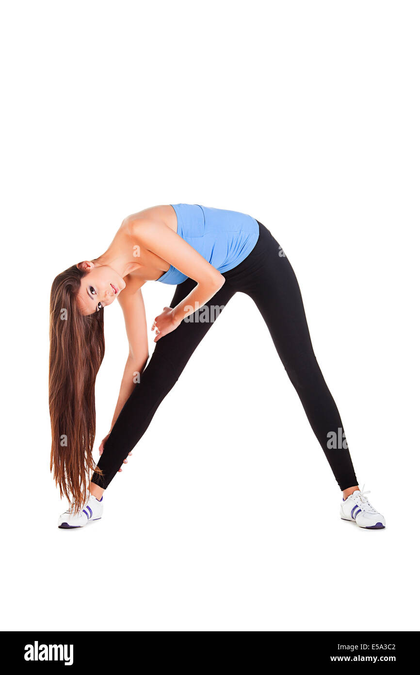 woman doing her gym exercise bending to the right on white background ...