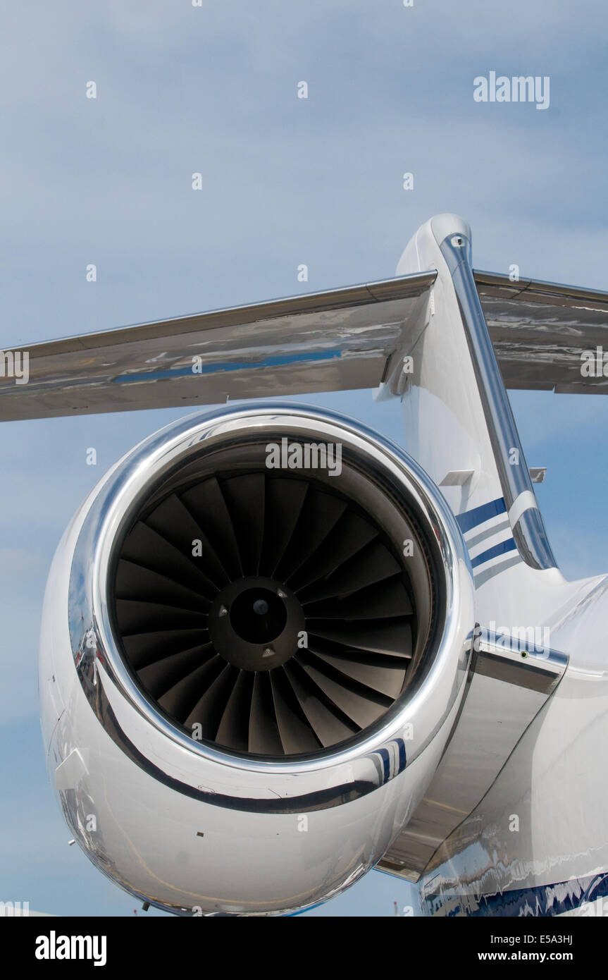 Engine and tail fin of white, luxury corporate jet Stock Photo - Alamy