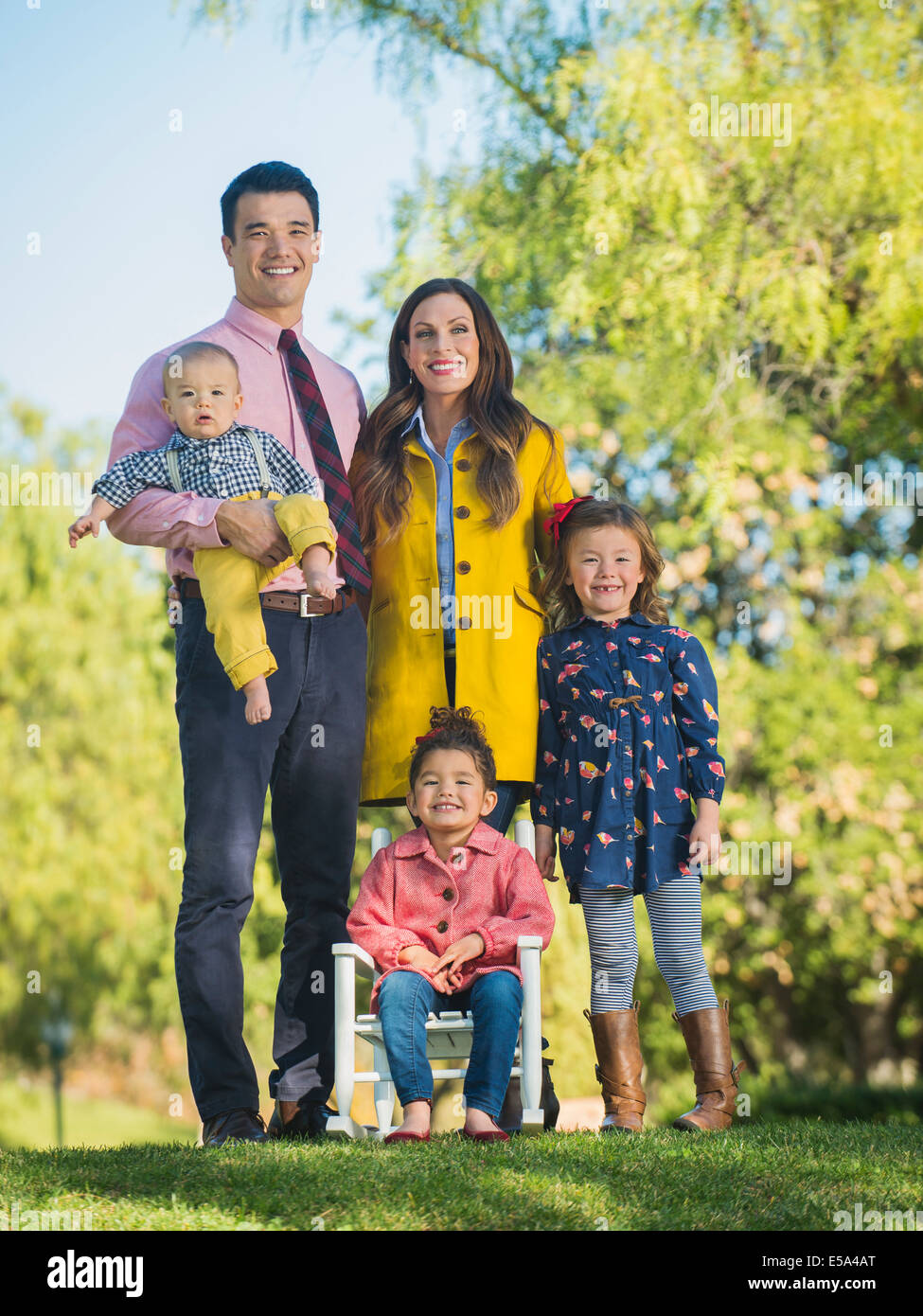 Family smiling together outdoors Stock Photo - Alamy