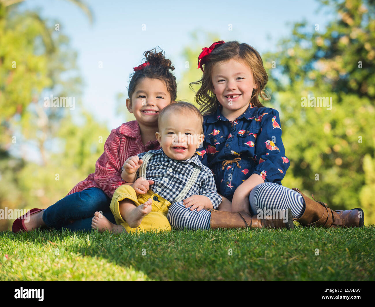 Siblings smiling together outdoors Stock Photo - Alamy