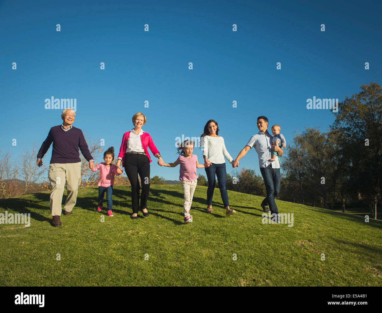 Walking park mother holding hi-res stock photography and images - Alamy