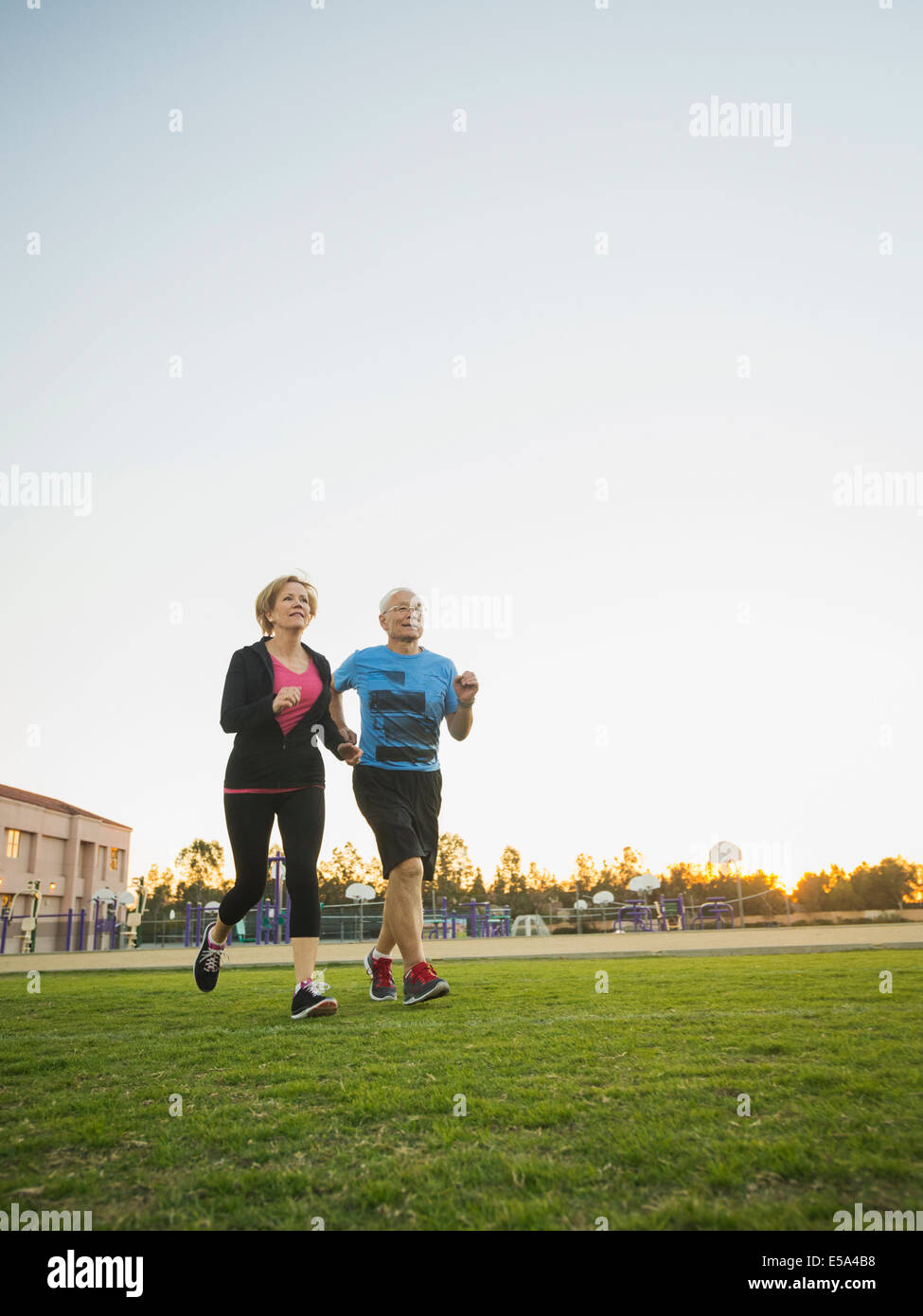 Women running together park hi-res stock photography and images - Alamy