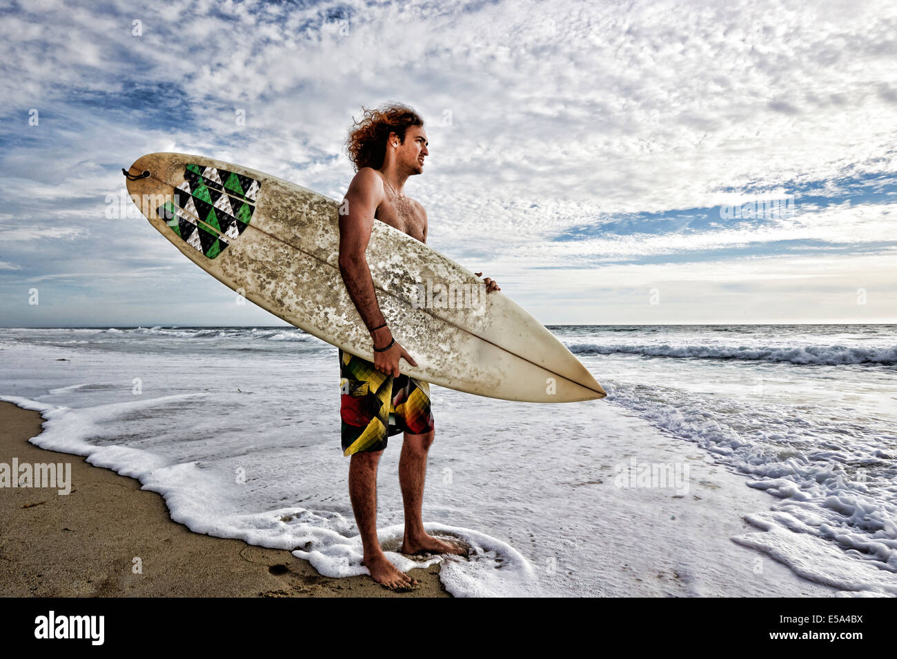 Man holding surfboard hi-res stock photography and images - Alamy