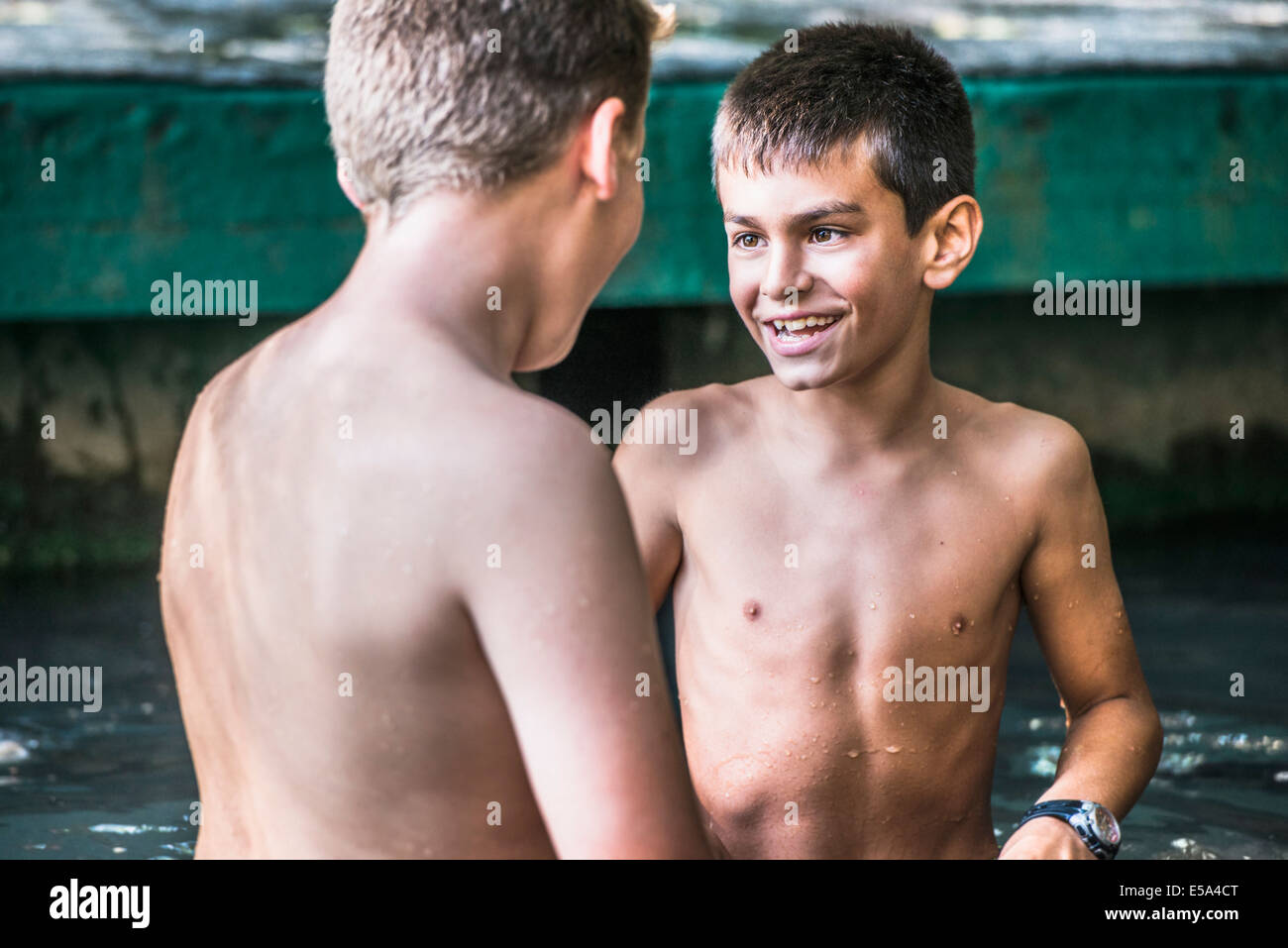 Child talking to group of children hi-res stock photography and images ...