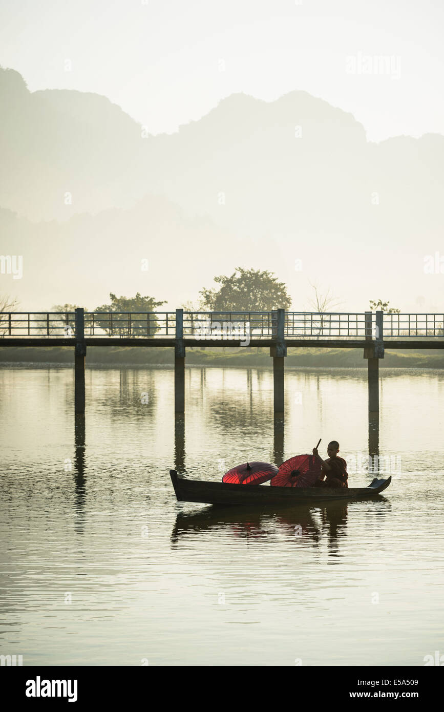 Mountains and bridge reflected in still lake, Hpa an, Kayin, Myanmar ...