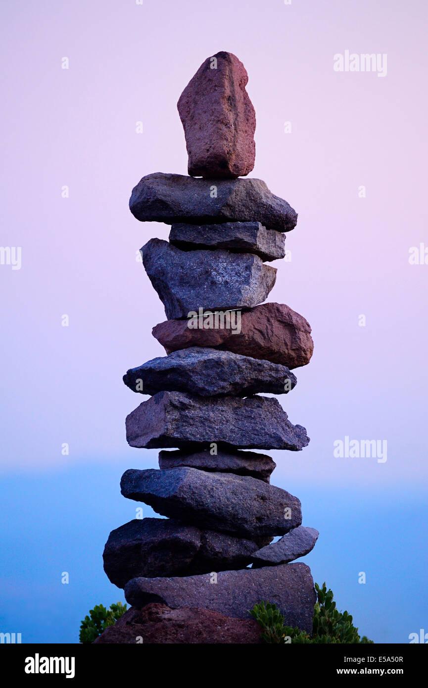 Rocks stacked neatly in rural landscape Stock Photo - Alamy