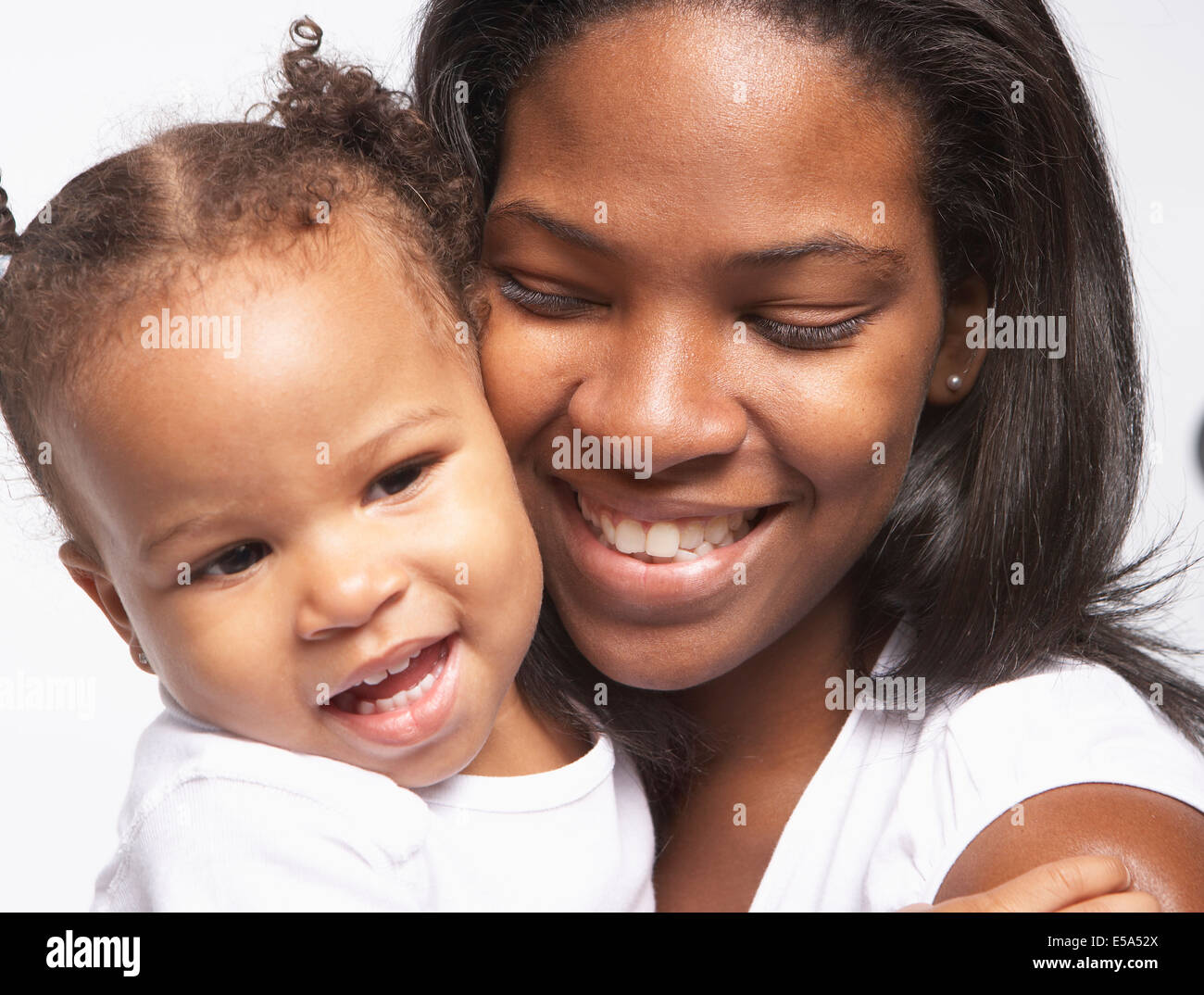 Smiling mother cradling baby Stock Photo - Alamy