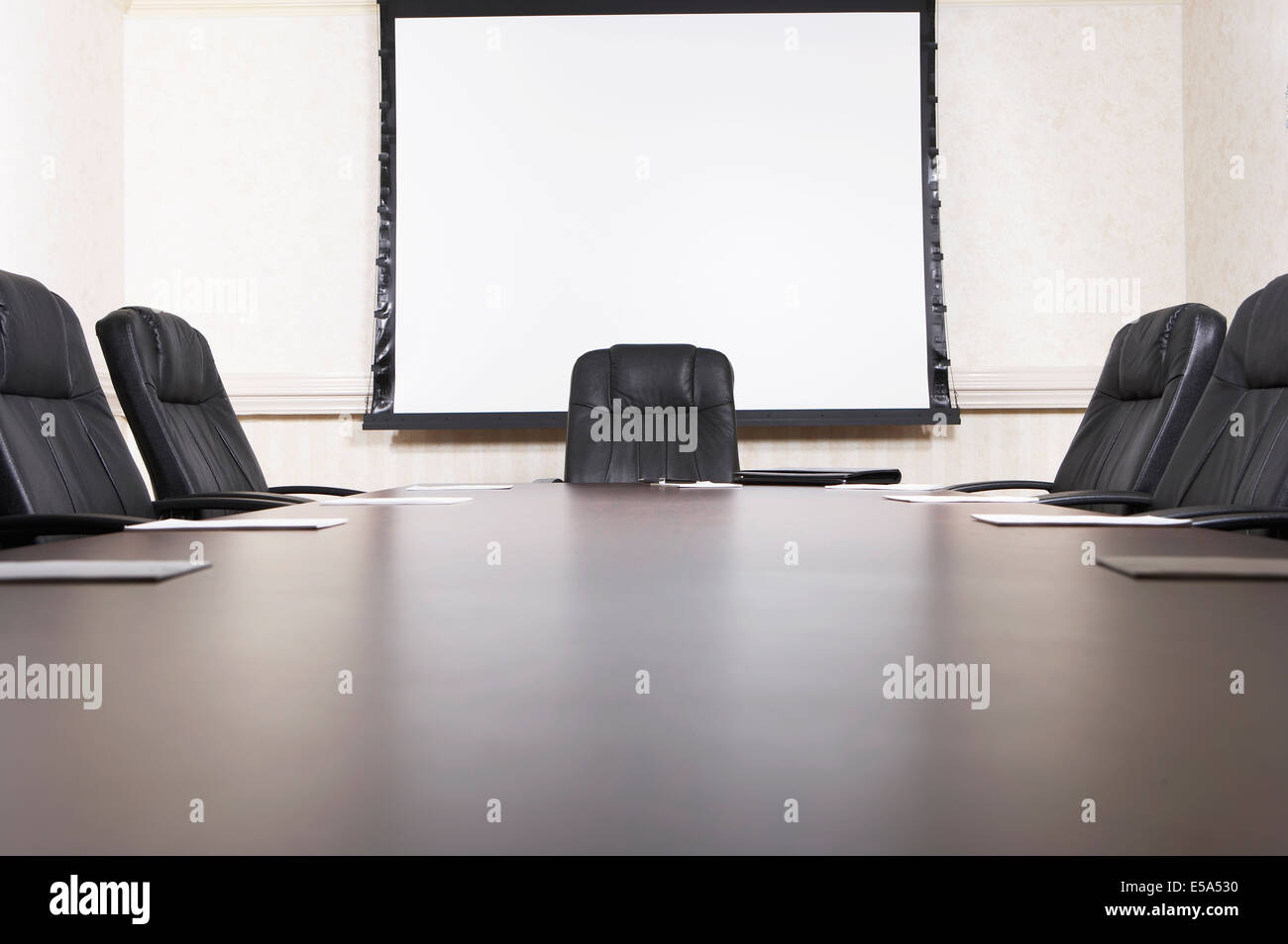 Empty chairs at conference table Stock Photo - Alamy