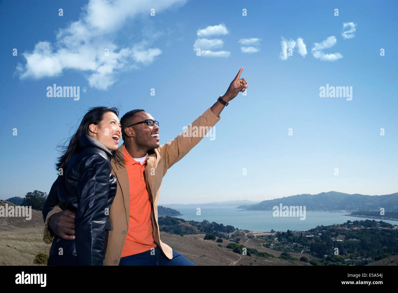 Couple admiring scientific formula in clouds Stock Photo - Alamy