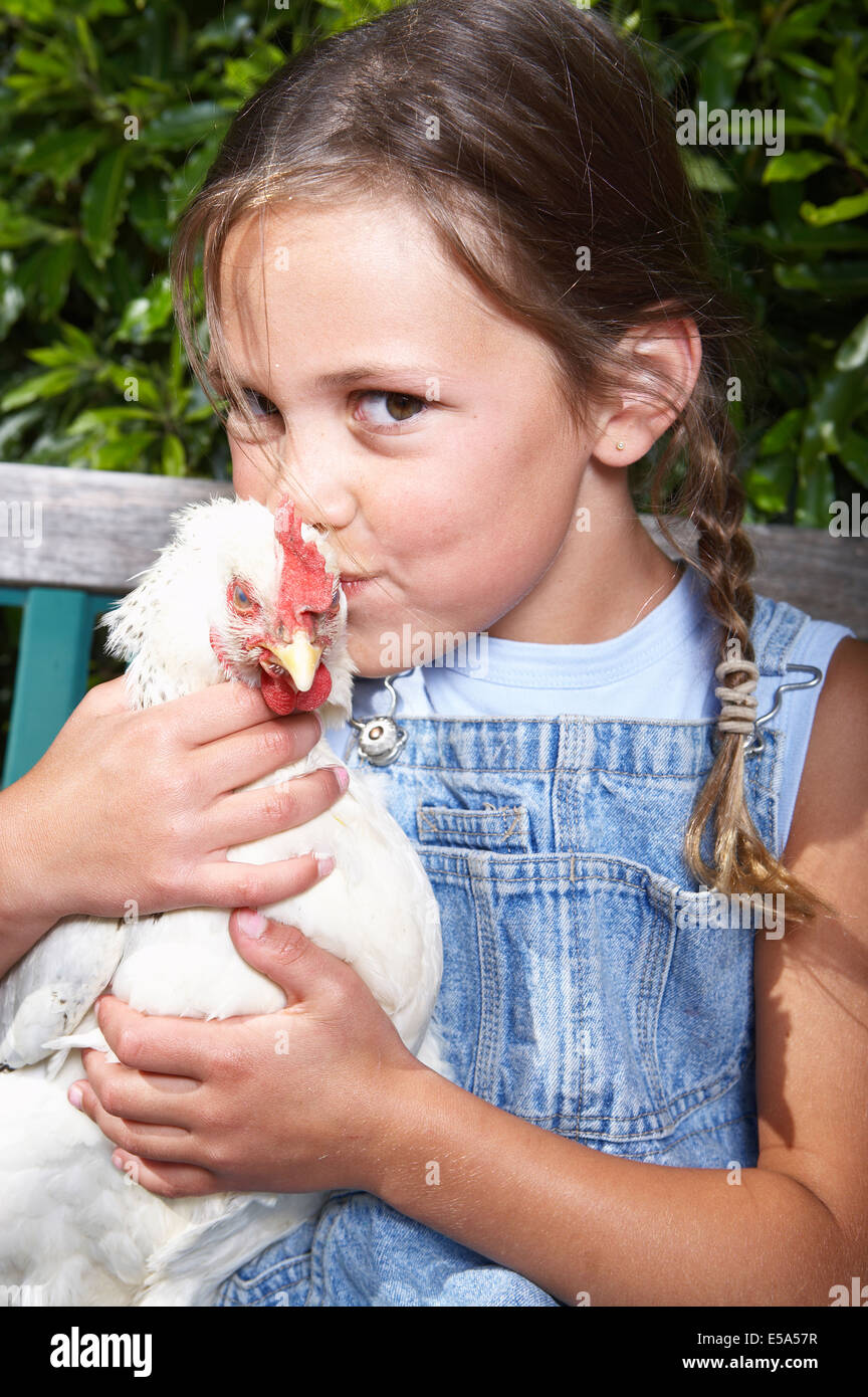 Girl with chicken on farm hi-res stock photography and images - Alamy