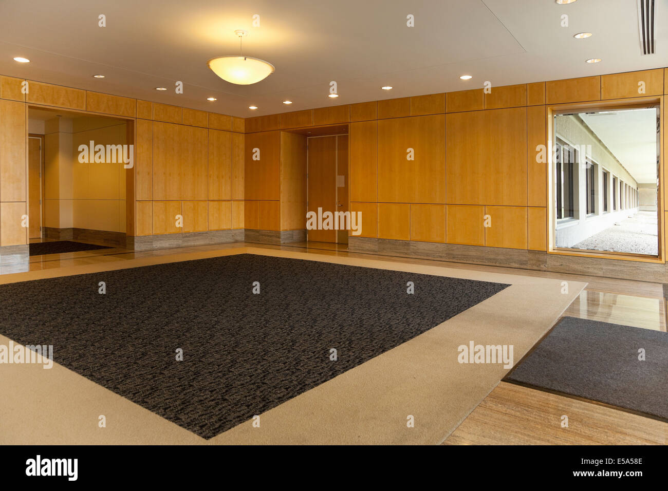 Empty lobby area in office building Stock Photo - Alamy