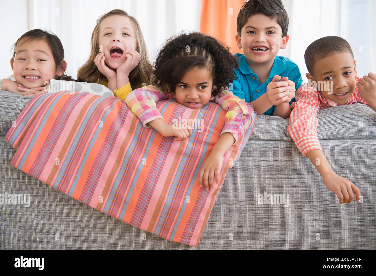 Children playing on sofa Stock Photo - Alamy