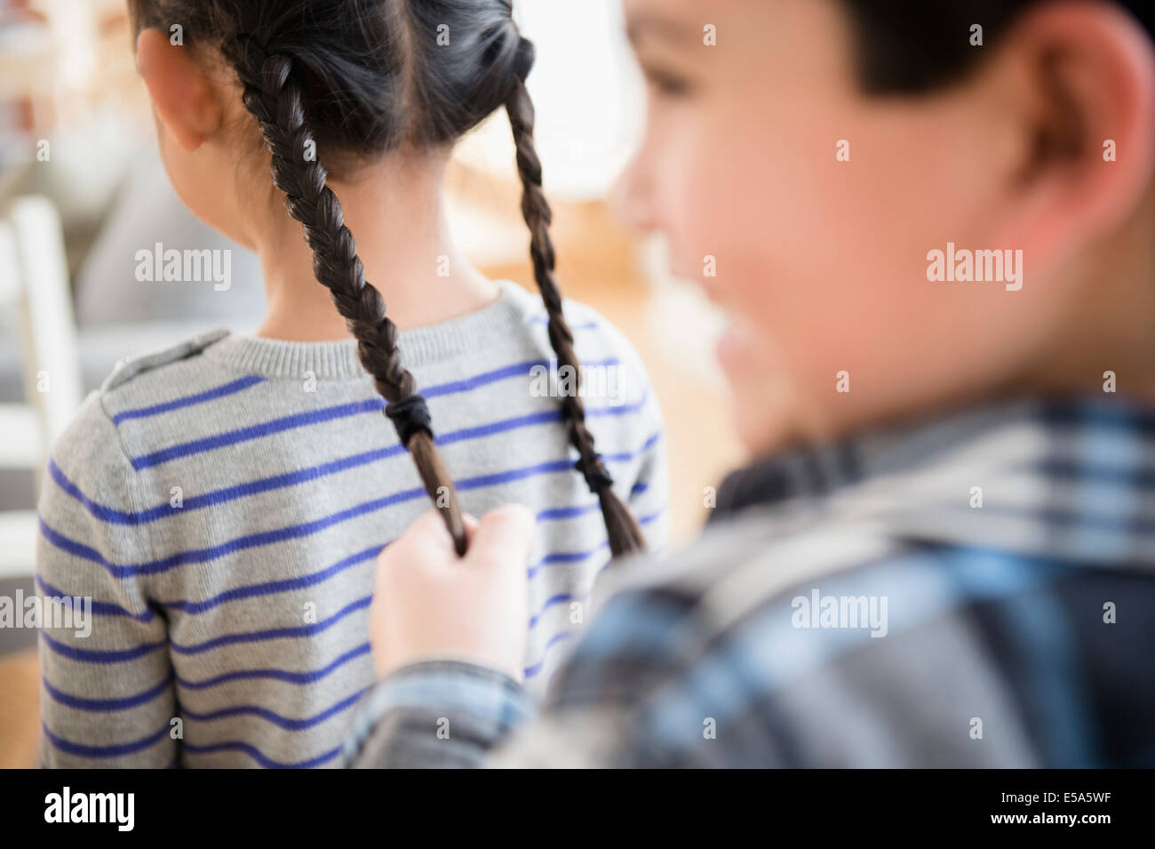 Pulling girls braid hi-res stock photography and images - Alamy