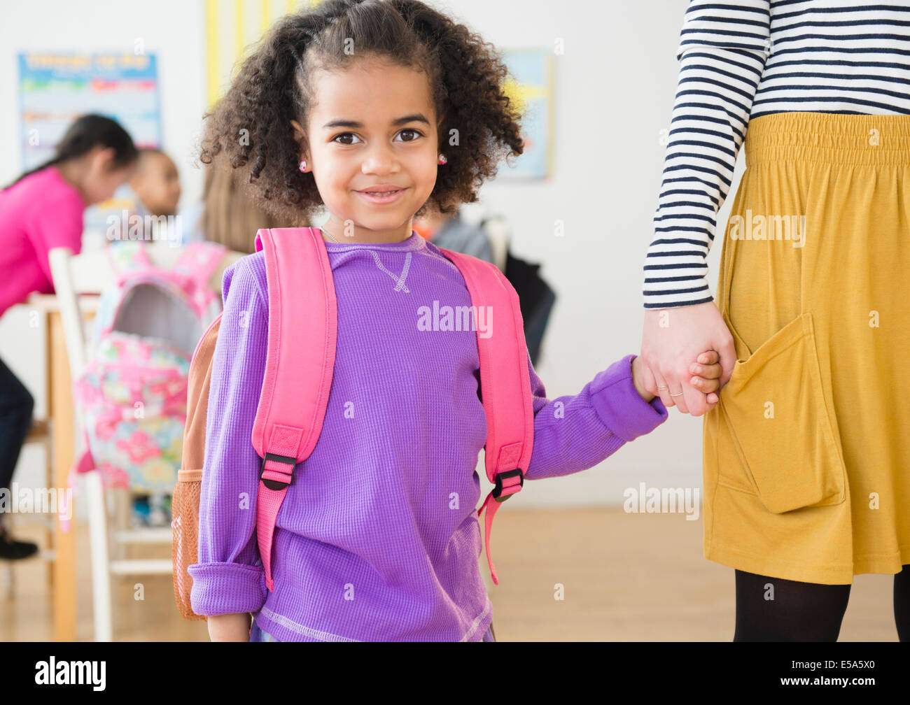 Student and teacher holding hands in classroom Stock Photo - Alamy Student and teacher holding hands in classroom Stock Photo - Alamy