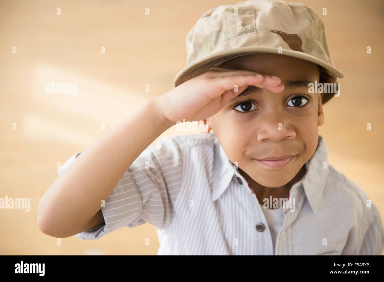African American boy giving salute Stock Photo - Alamy
