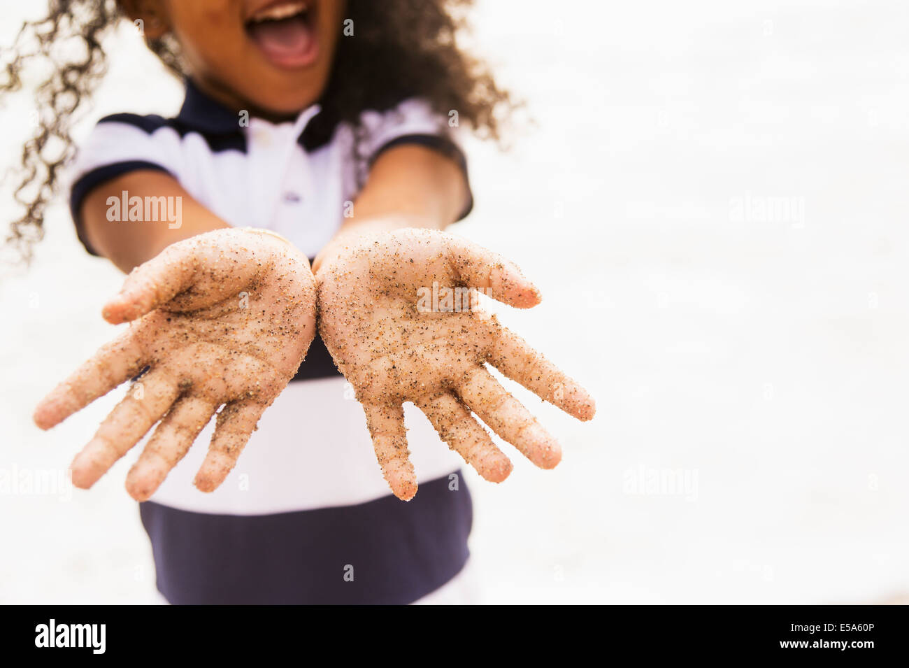Girl with sandy hands hi-res stock photography and images - Alamy