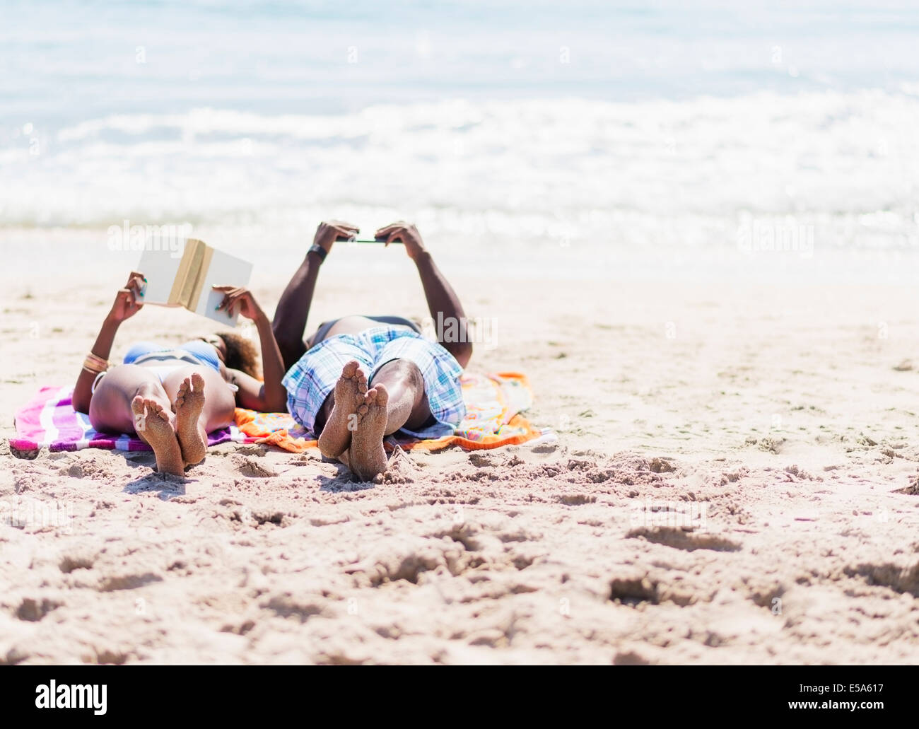 Couple Laying Beach High Resolution Stock Photography and Images - Alamy