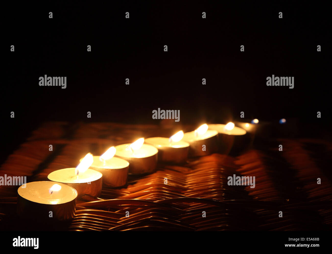 Igniting candles hi-res stock photography and images - Alamy