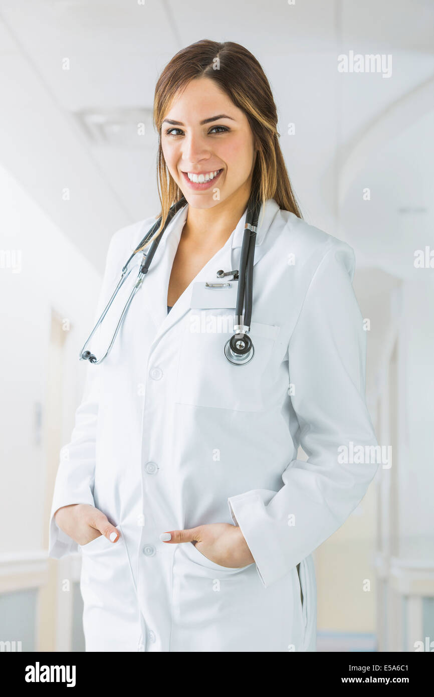 Mixed race doctor smiling in hospital Stock Photo - Alamy