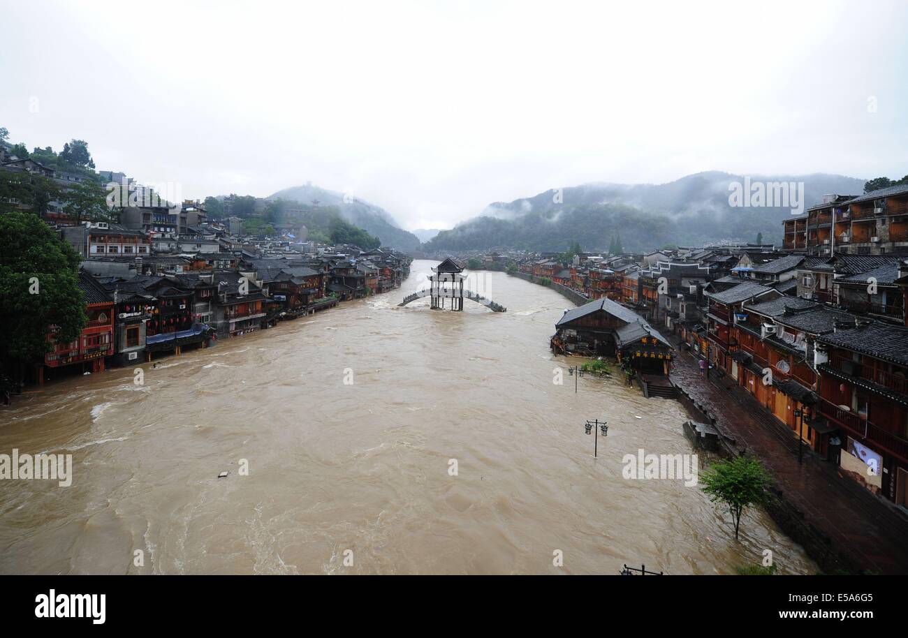 Buildings are submerged by flood water at the Fenghuang Ancient Town on ...