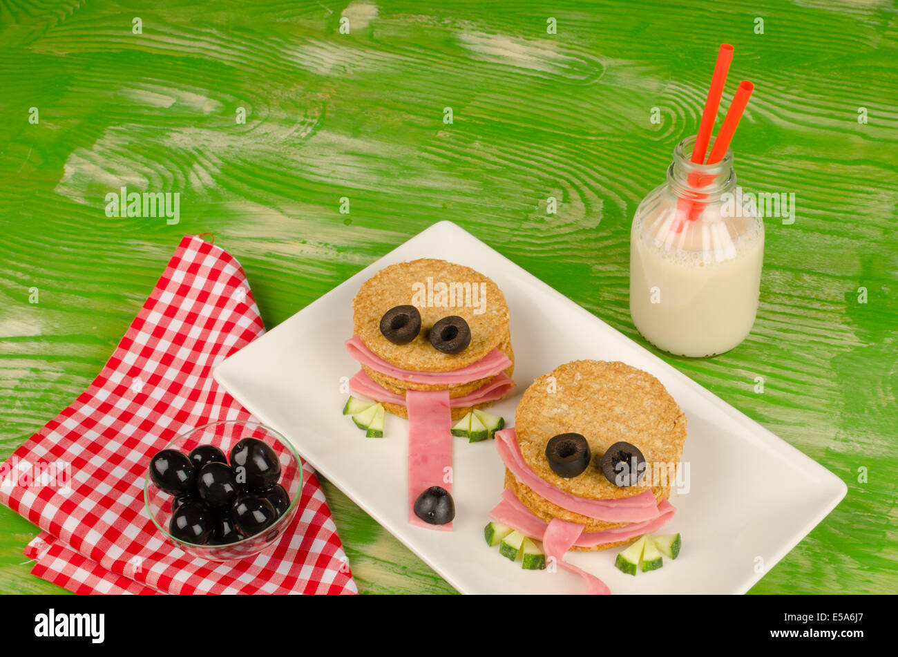 Funny kid snack with crunchy crackers resembling faces Stock Photo - Alamy