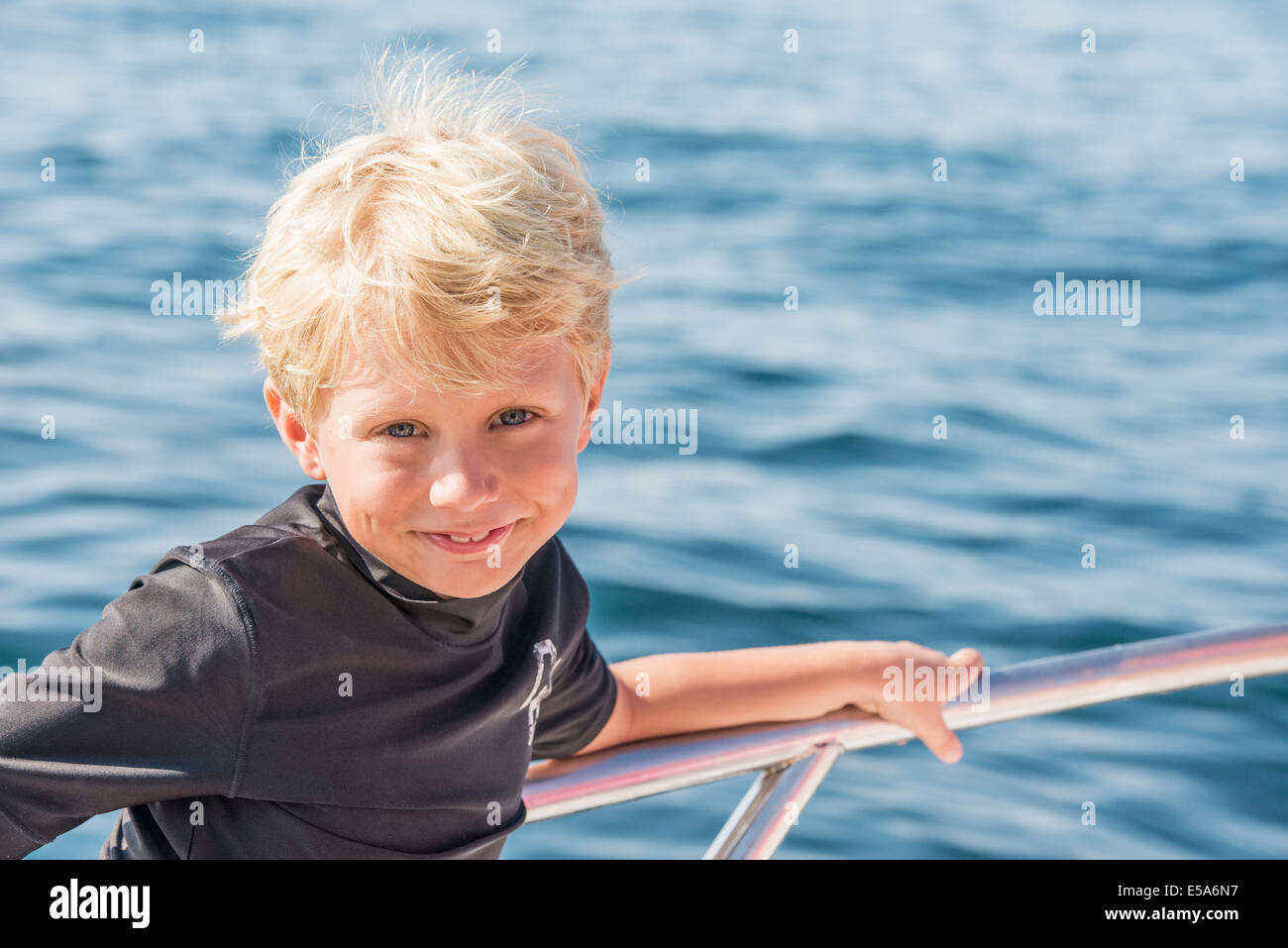 Boy on boat hi-res stock photography and images - Alamy