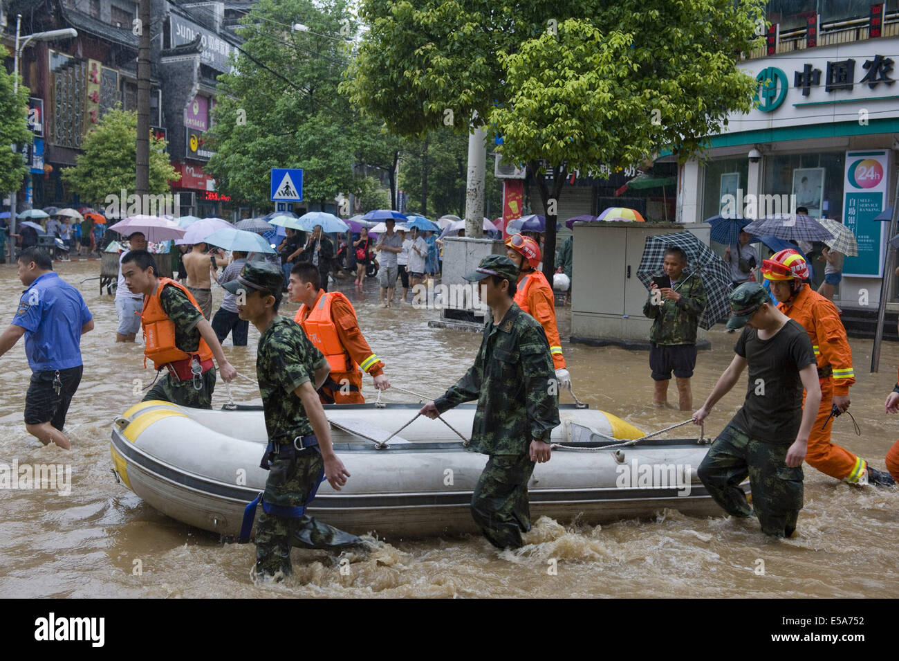 Buildings are submerged by flood water at the Fenghuang Ancient Town on ...
