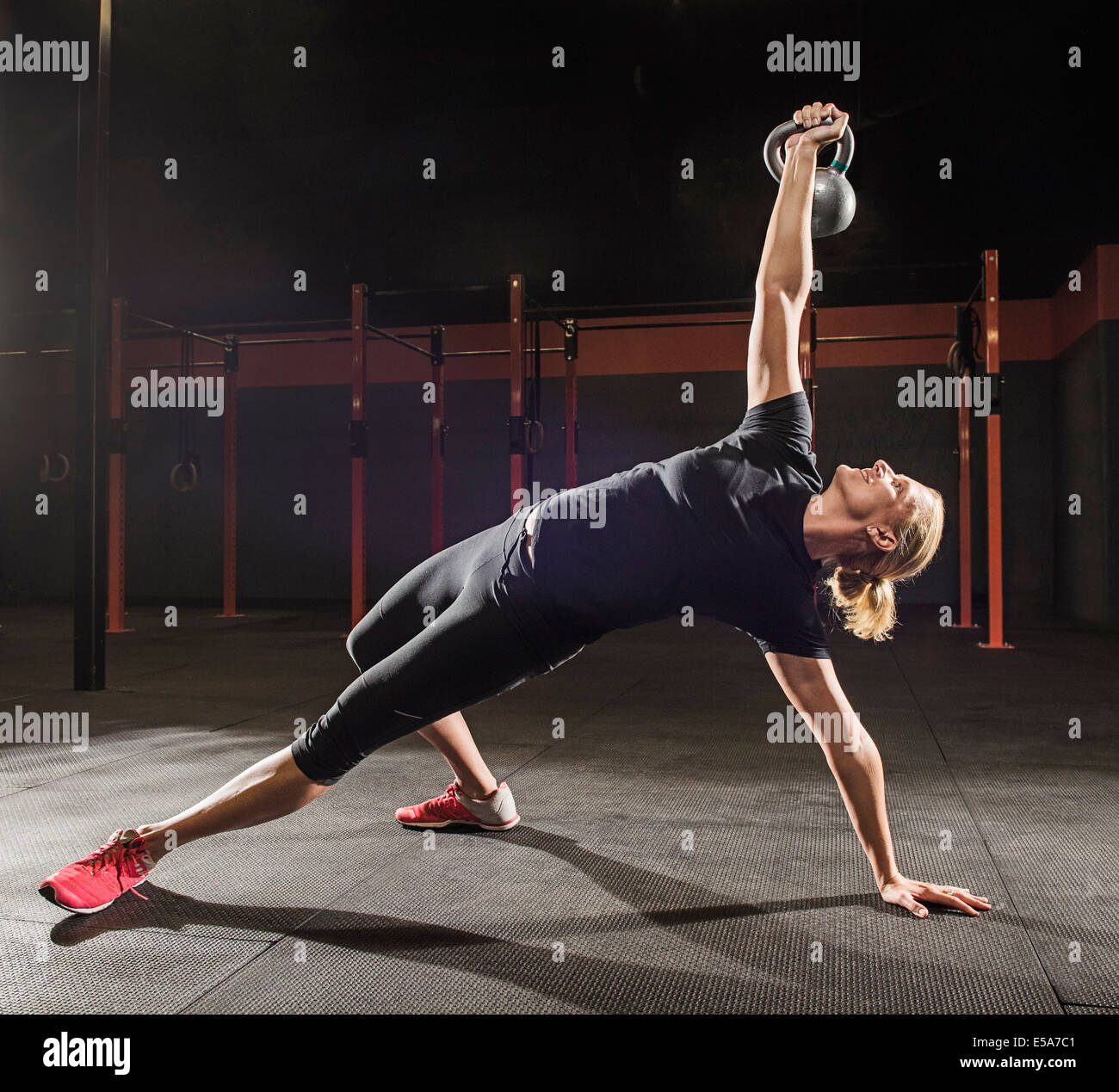 Caucasian woman lifting weights in gym Stock Photo - Alamy