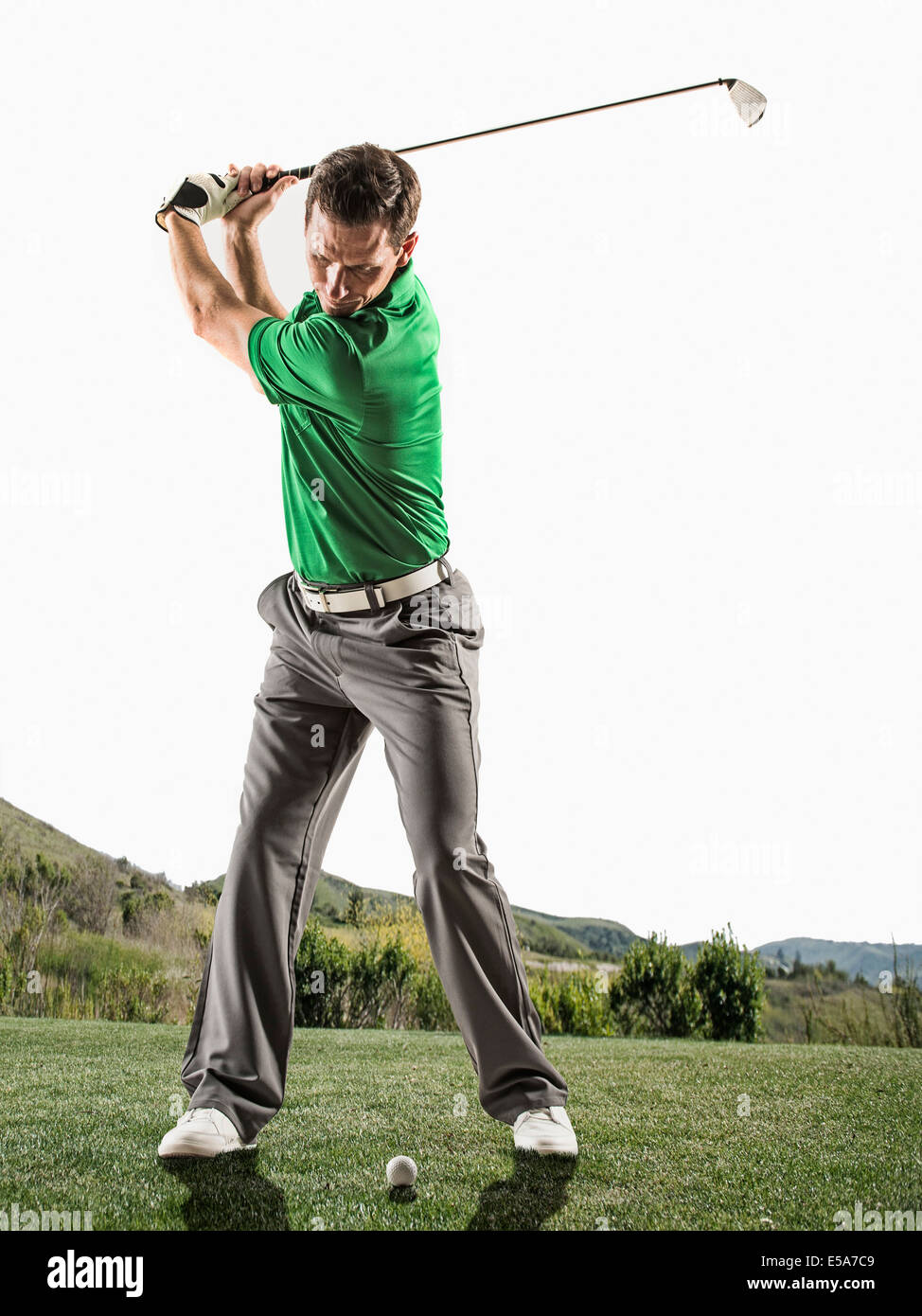 Caucasian man playing golf on course Stock Photo - Alamy