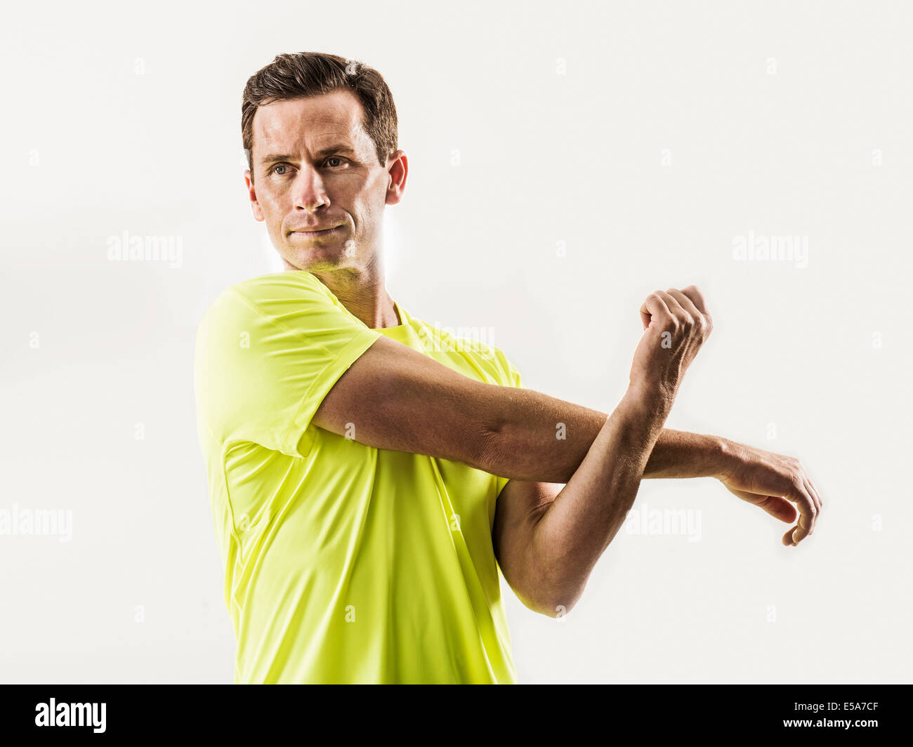 Caucasian man stretching Stock Photo - Alamy