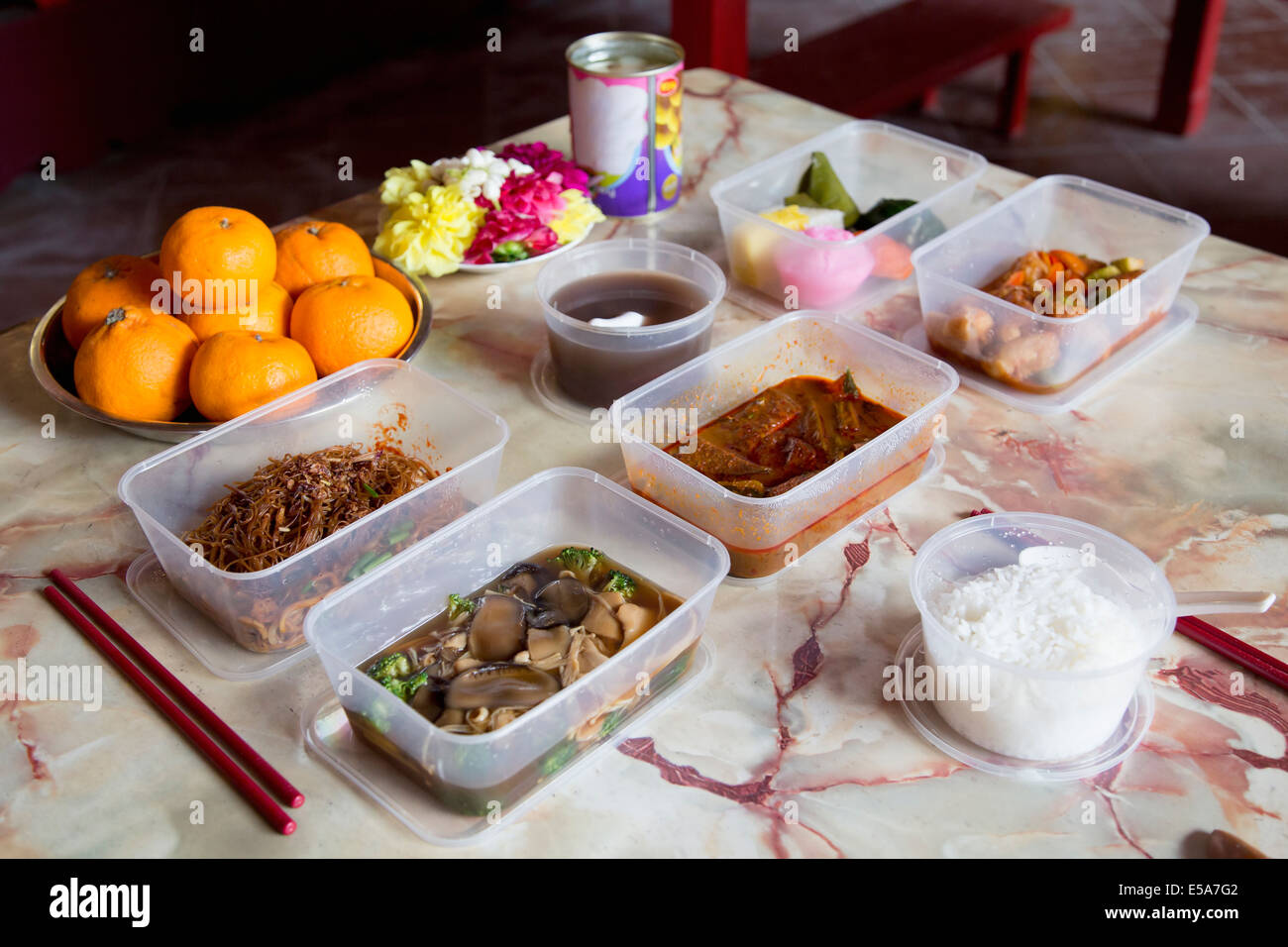 Food offerings in Buddhist temple for Chinese New Year Stock Photo - Alamy