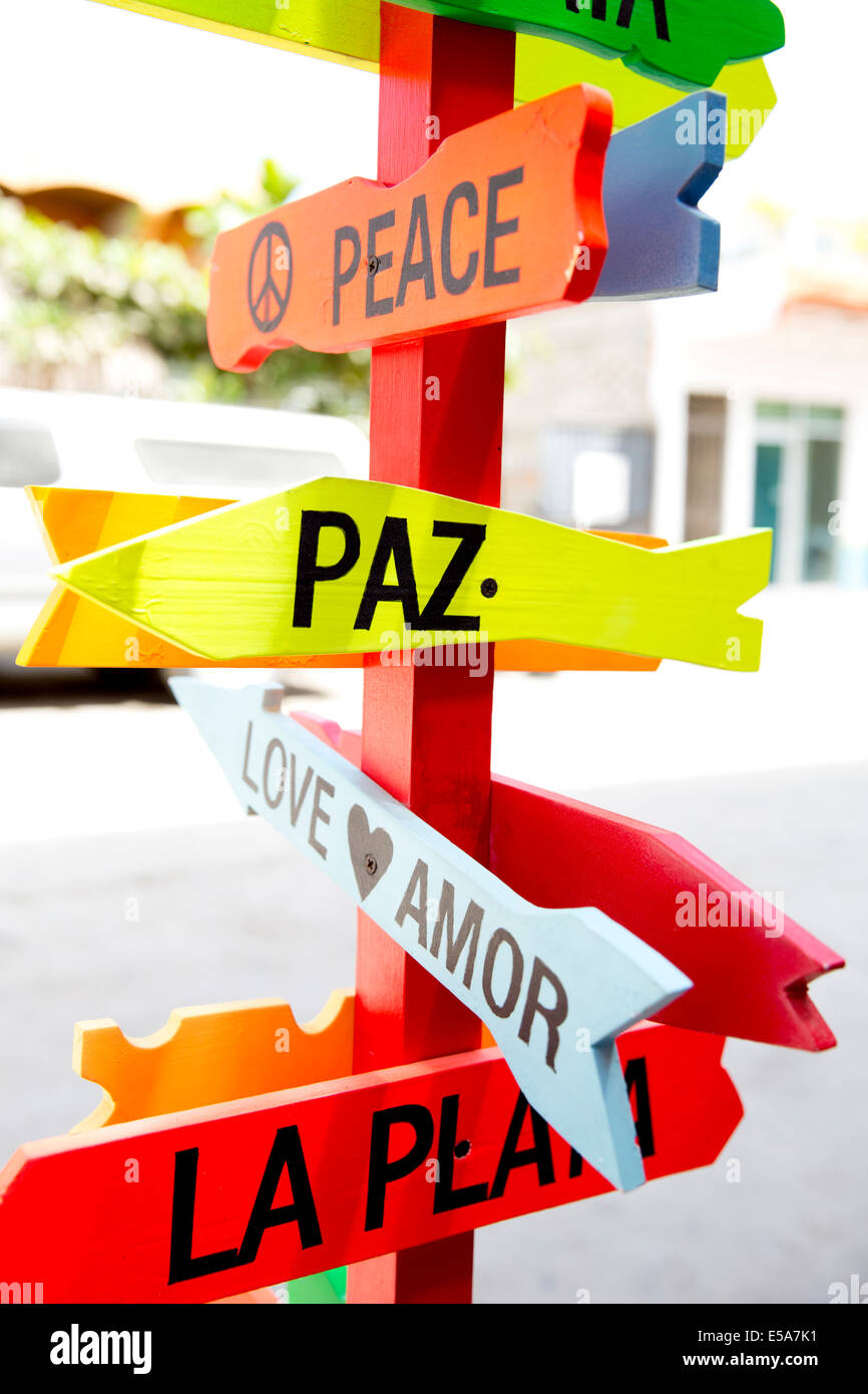 Colorful road signs to Peace and Love Stock Photo - Alamy
