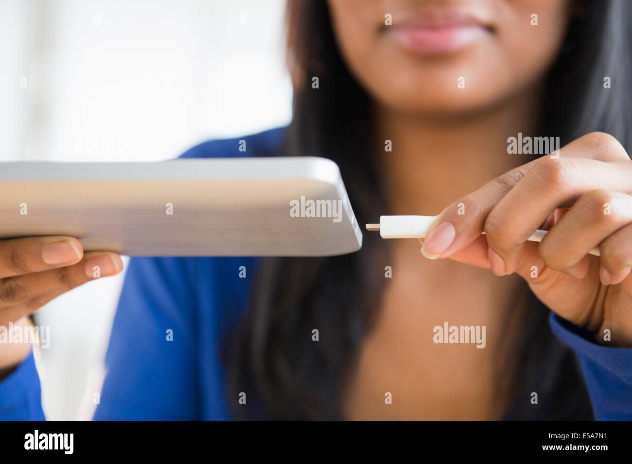 Woman plugging hi-res stock photography and images - Alamy
