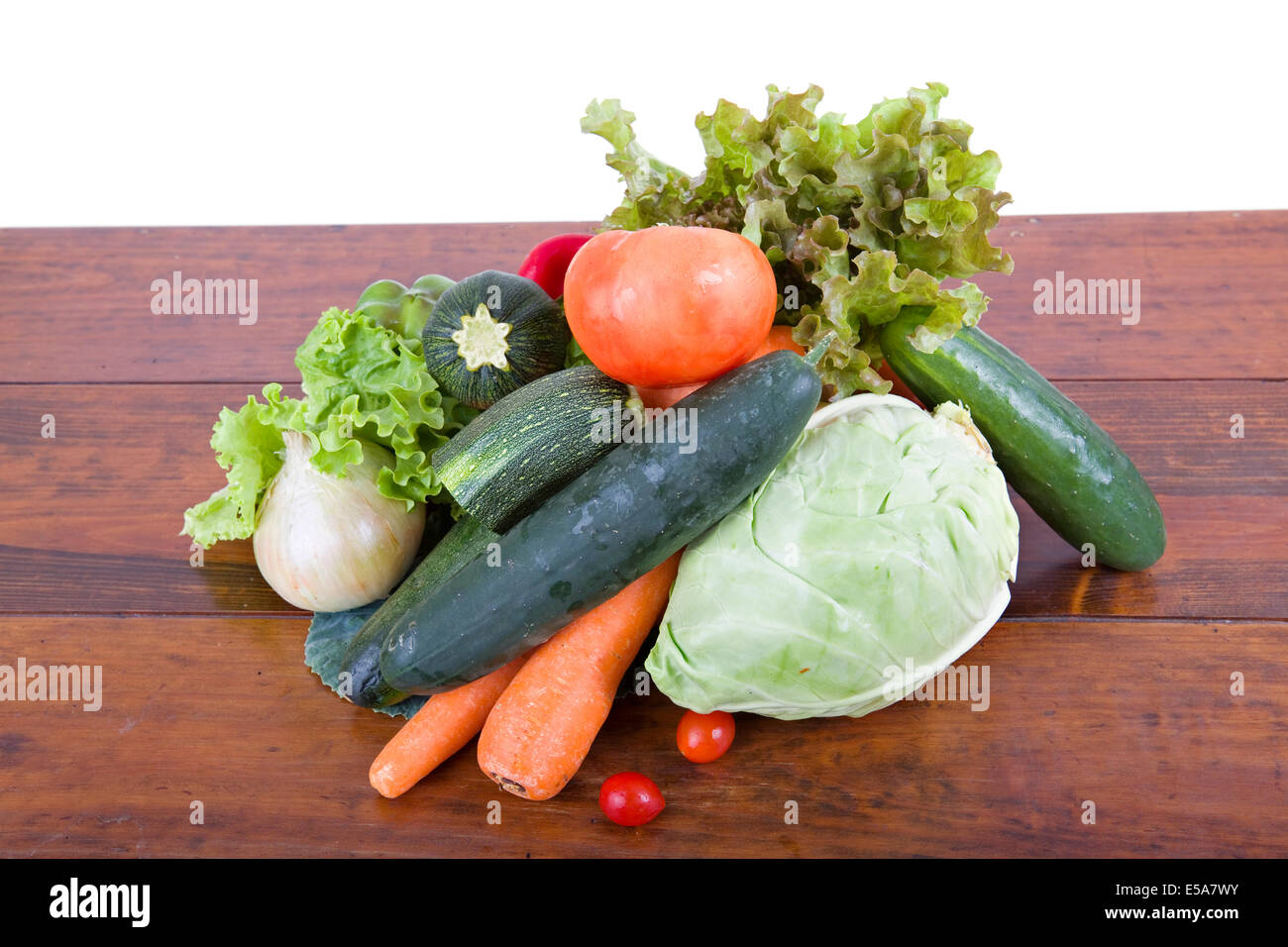 Fresh vegetables on wooden table Stock Photo - Alamy