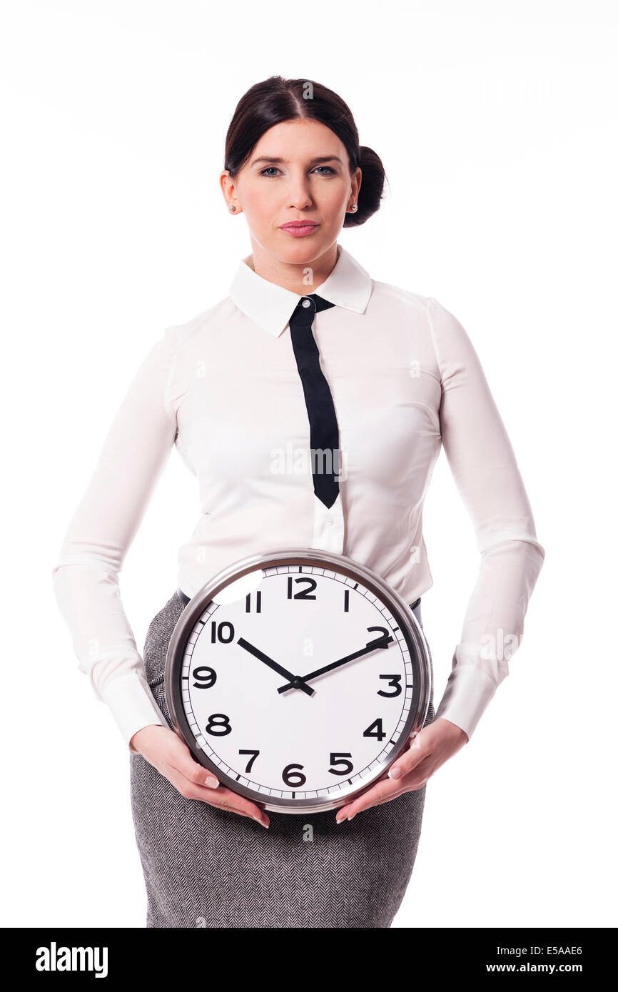Woman holding clock looking camera hi-res stock photography and images ...