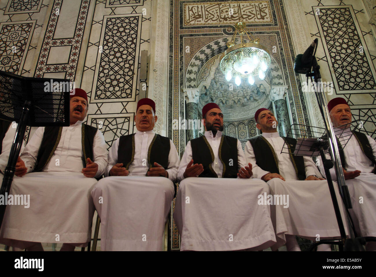 Damascus, Syria. 25th July, 2014. Syrians pray at Umayyad Mosque in the ...