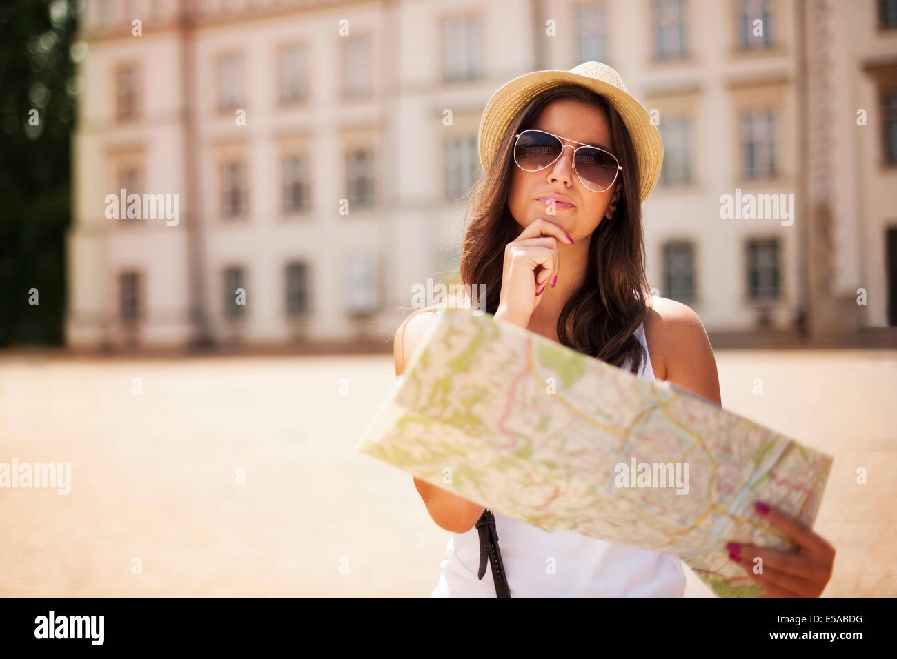Tourist girl with map wondering where she should go, Debica, Poland ...