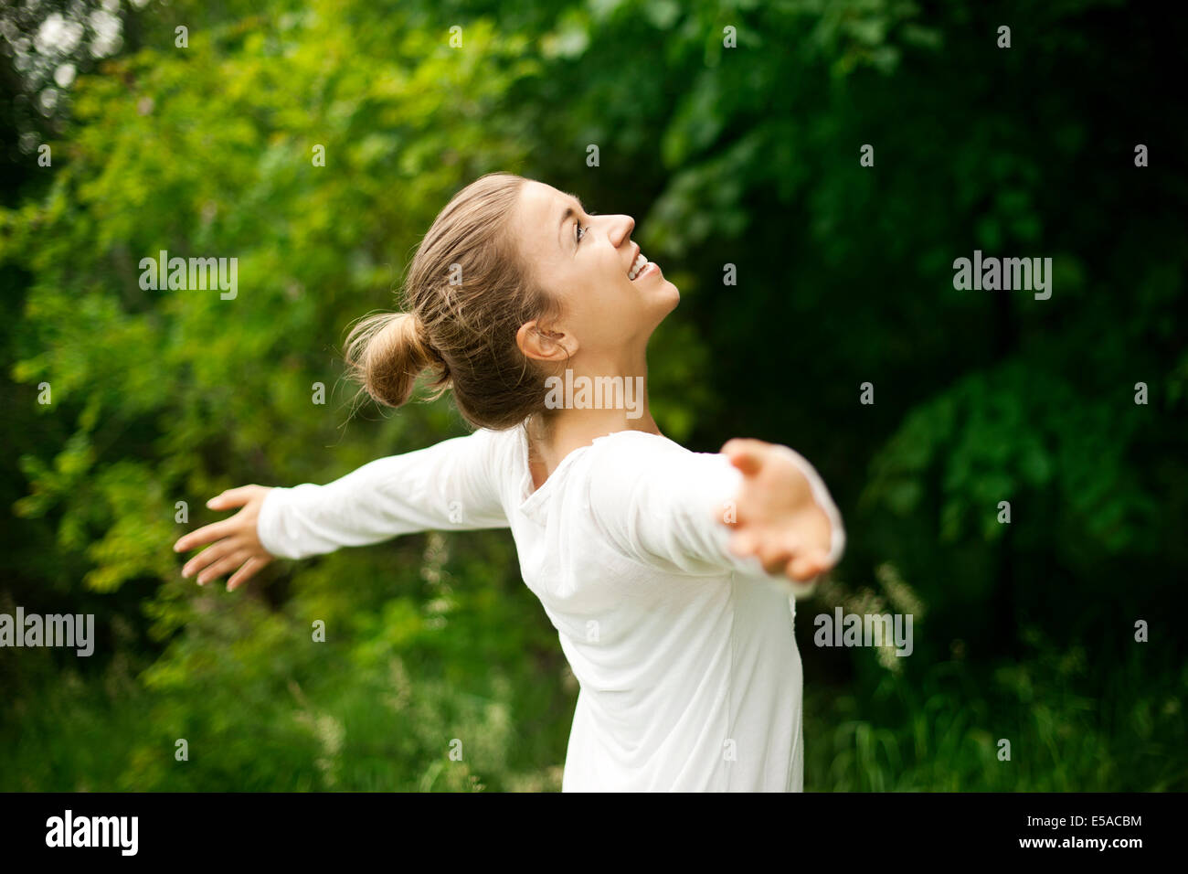 Young woman with stretched out arms, Debica Poland Stock Photo - Alamy