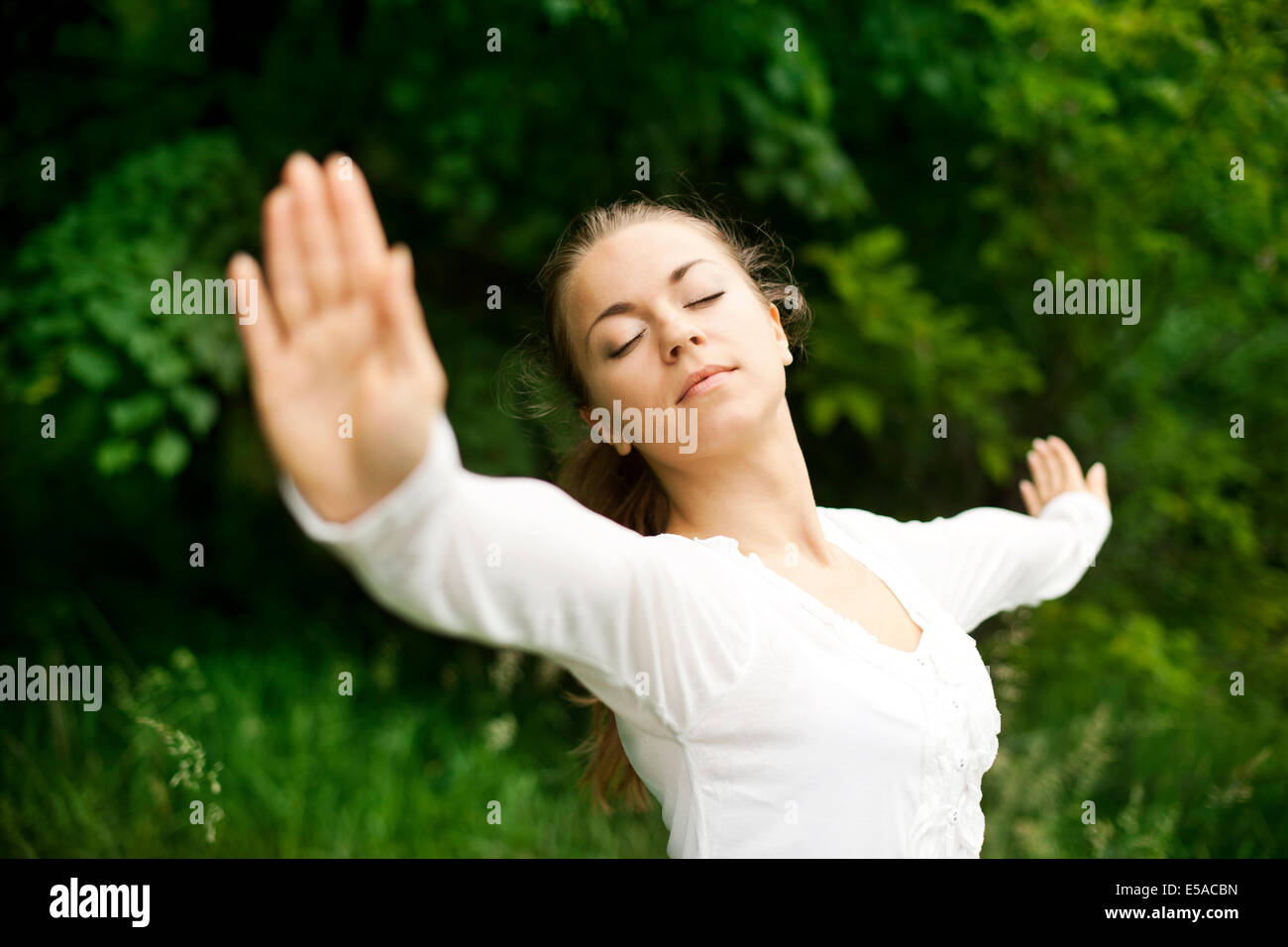 Young woman with stretched out arms, Debica Poland Stock Photo - Alamy